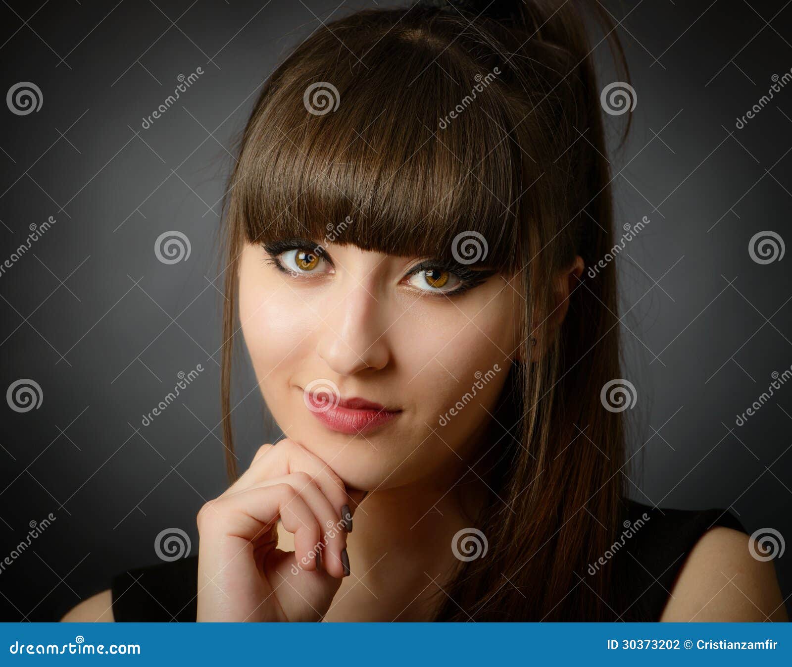 A Young Beautiful Woman with Bangs in Studio Stock Photo - Image of ...