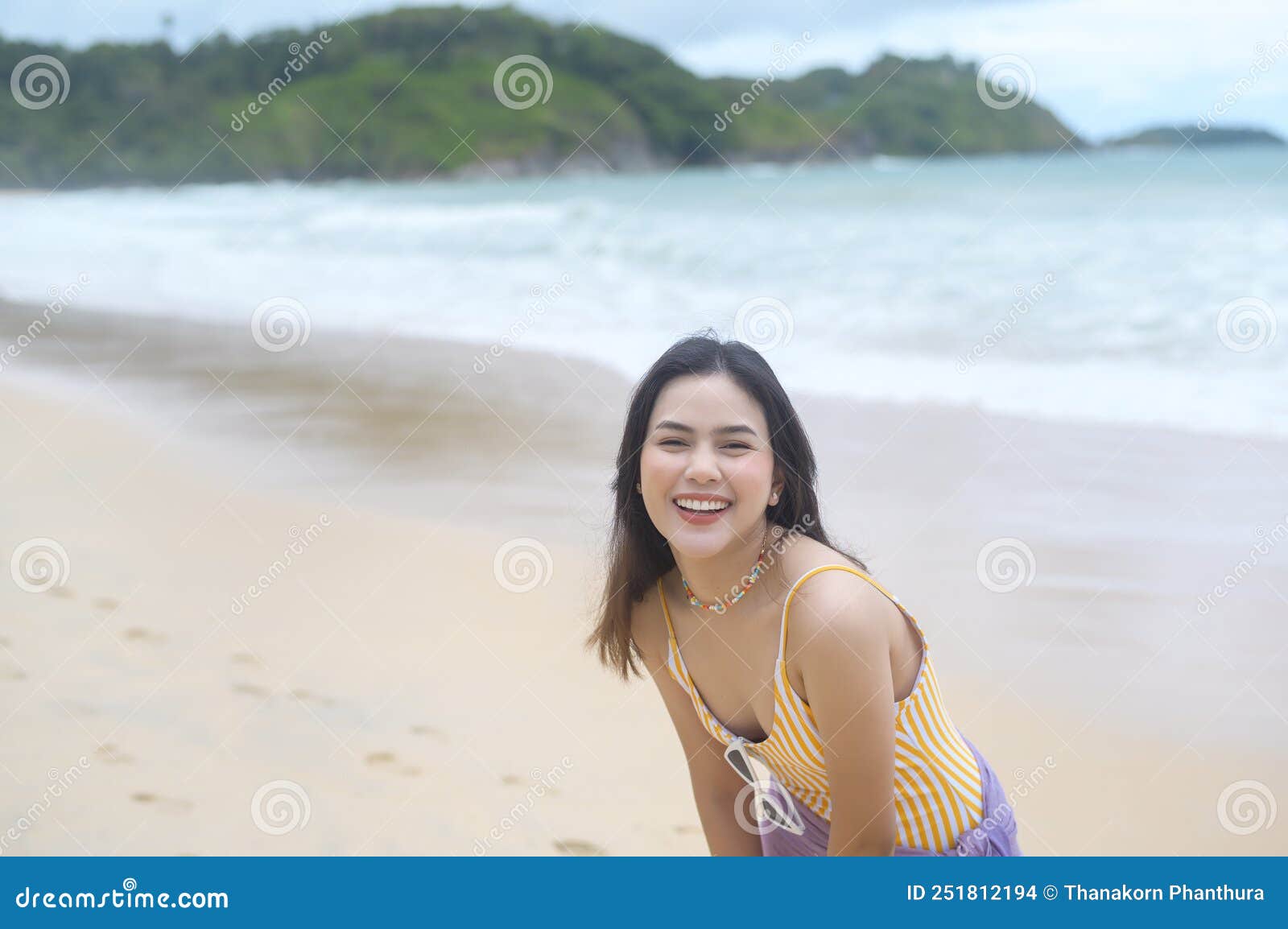 Young Beautiful Woman In Bikini Enjoying And Relaxing On The Beach