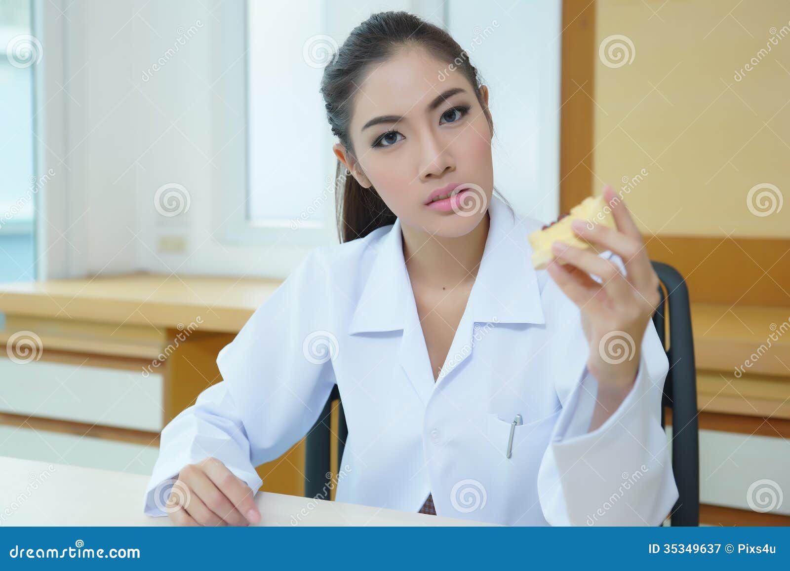 Young Beautiful Woman Dentist Holding Denture Cast Model Stock Image