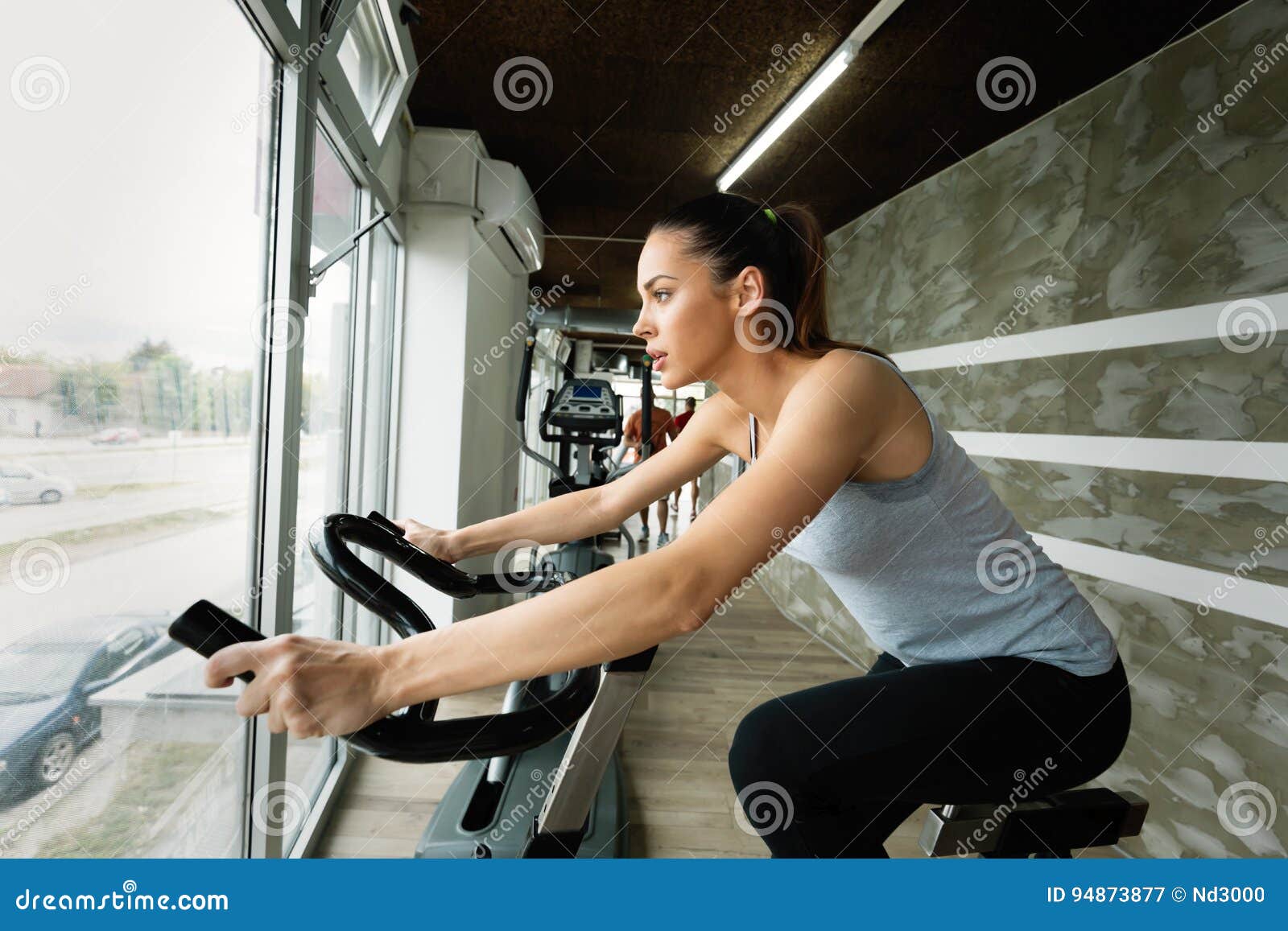 Young Beautiful Woman Doing Indoor Biking Exercise Stock Image - Image ...