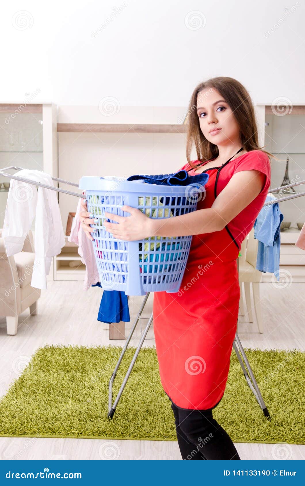The Young Beautiful Woman Doing Laundry at Home Stock Photo - Image of ...
