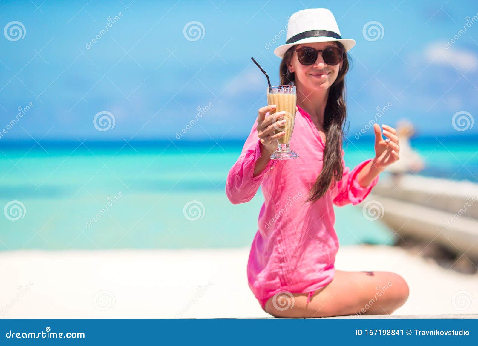 Young Beautiful Woman Enjoying Summer Vacation In Luxury Swimming Pool