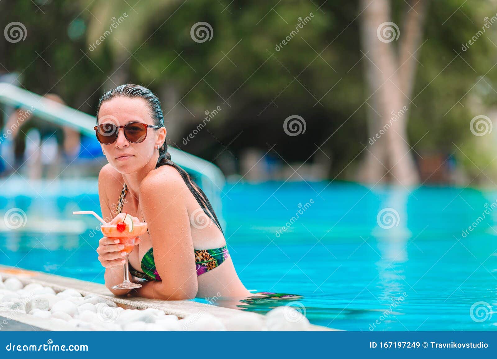 Young Beautiful Woman Enjoying Summer Vacation in Luxury Swimming Pool ... Young Beautiful Woman Enjoying Summer Vacation in Luxury Swimming Pool ...