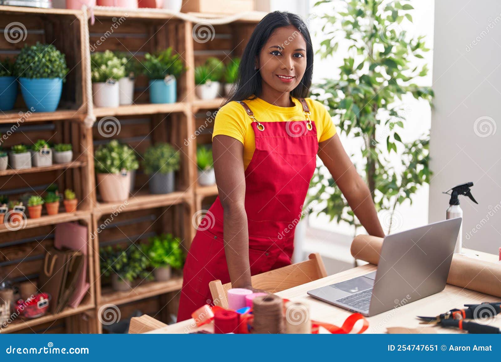Young Beautiful Woman Florist Smiling Confident Standing at Florist ... Young Beautiful Woman Florist Smiling Confident Standing at Florist ...