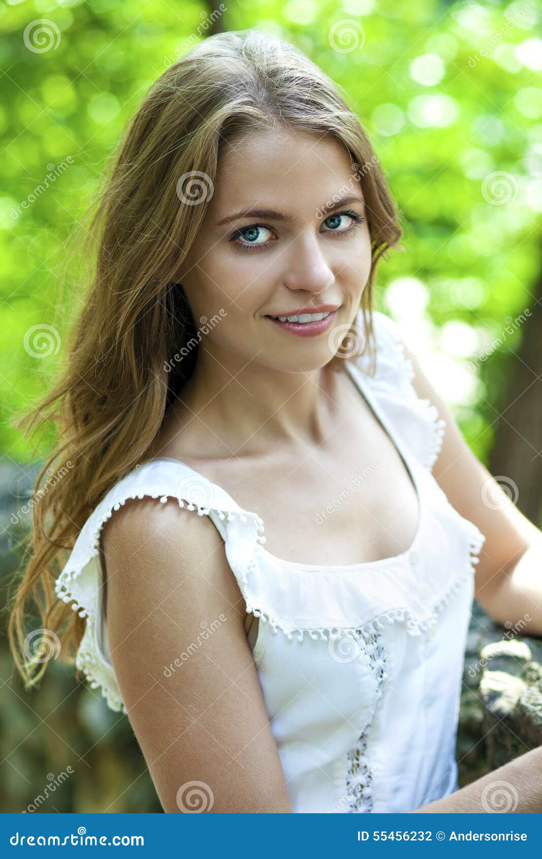 Young Beautiful Woman In Green Dress Posing Outdoors In Sunny We Stock