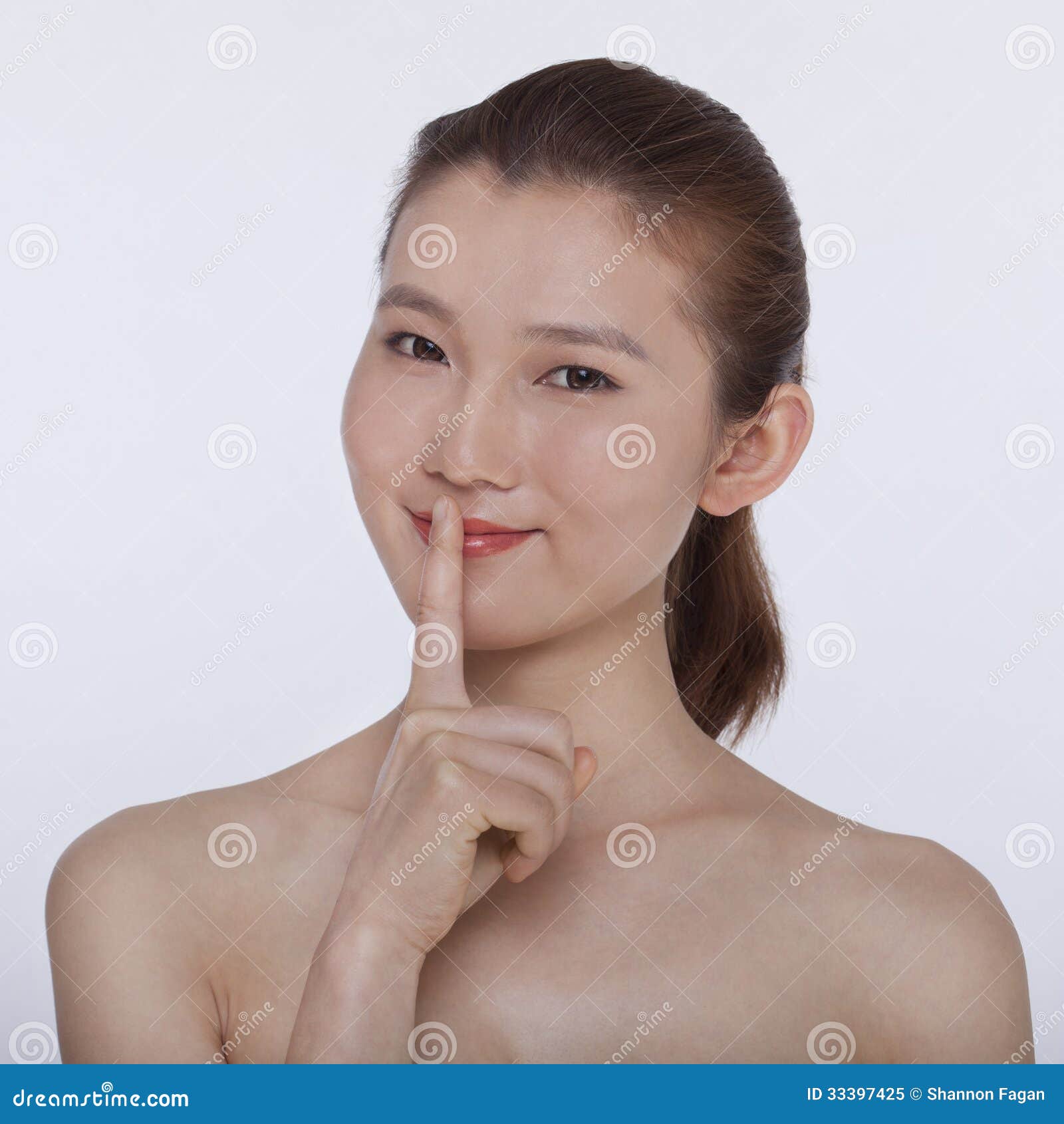 Young Beautiful Woman with Her Hands on Her Lips, Looking at Camera ...