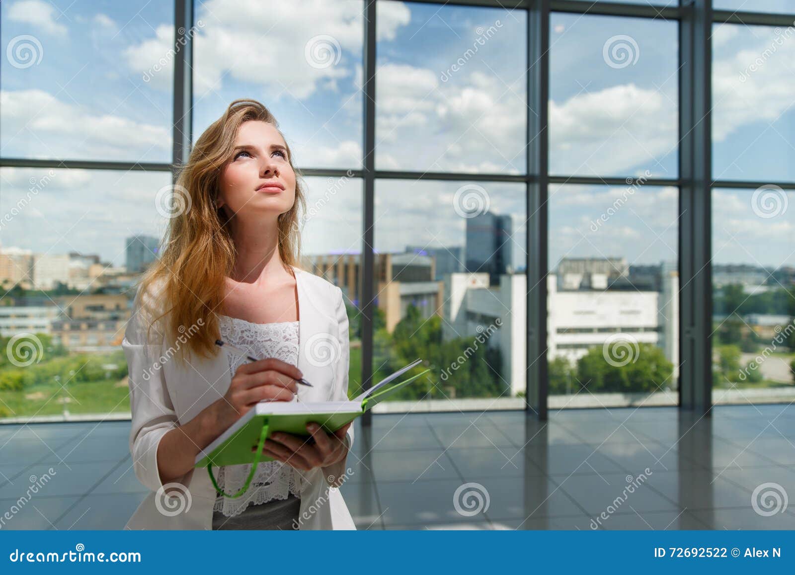 Young Beautiful Woman Holding Green Notebook. Stock Photo - Image of ...