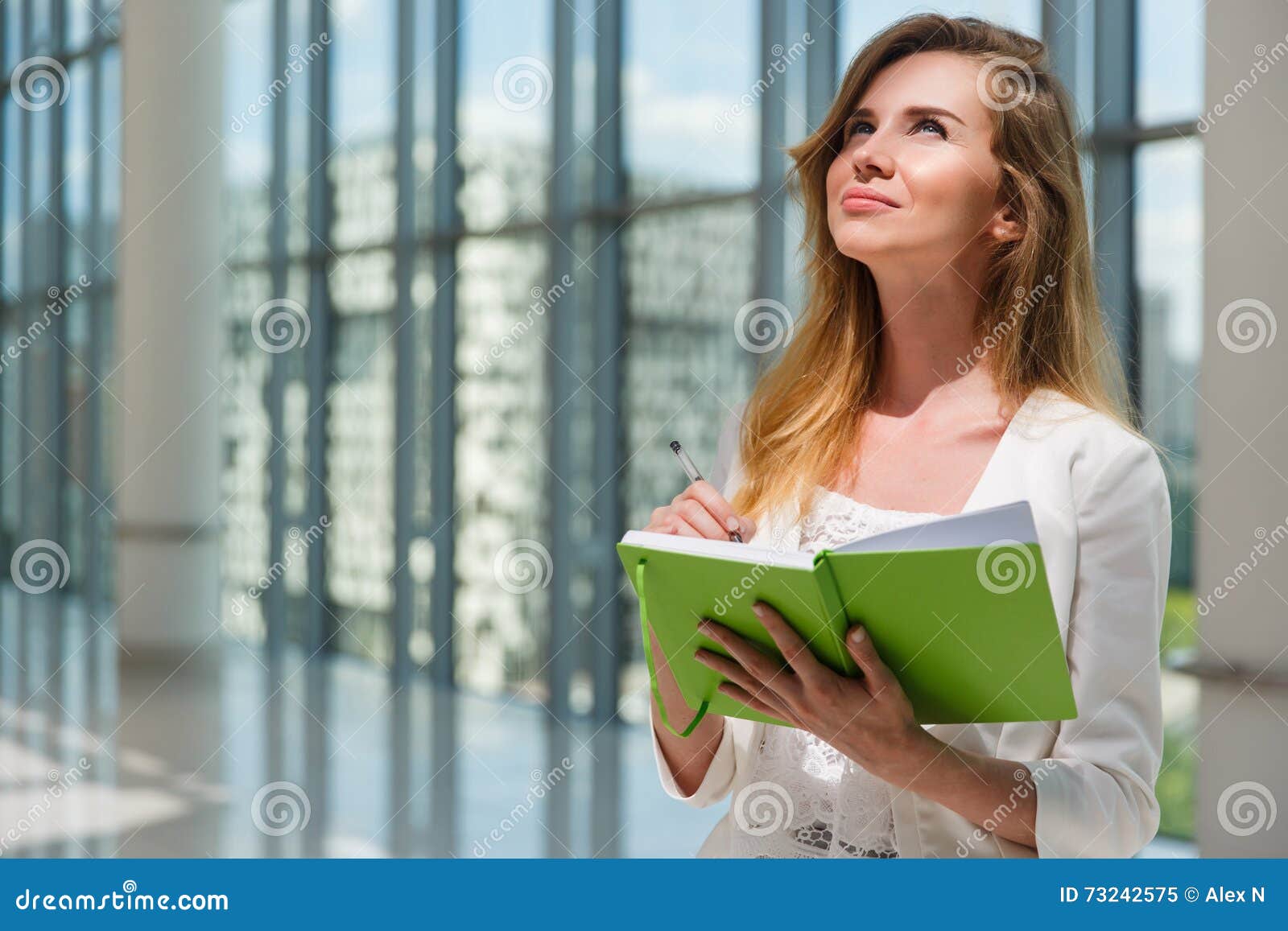 Young Beautiful Woman Holding Green Notebook. Stock Image - Image of ...