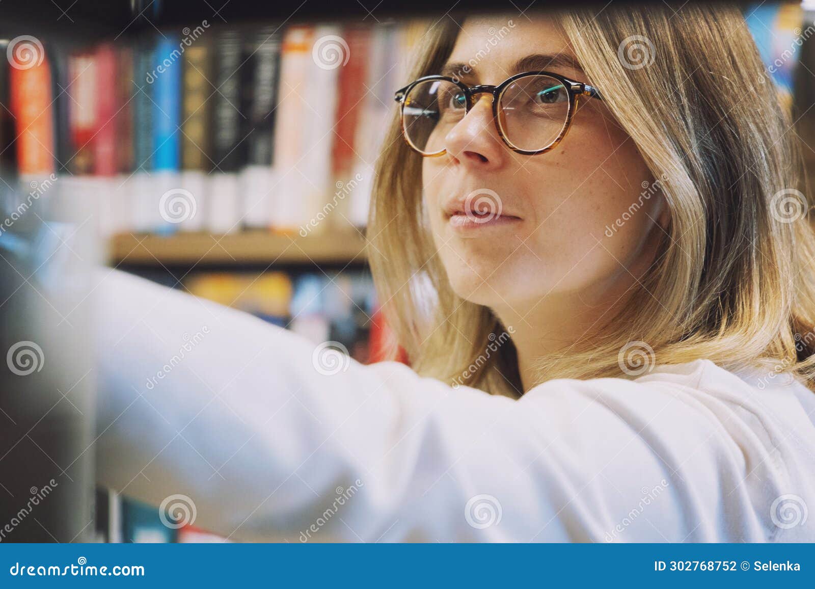Young Beautiful Woman in a Library Stock Photo - Image of cute, student ...