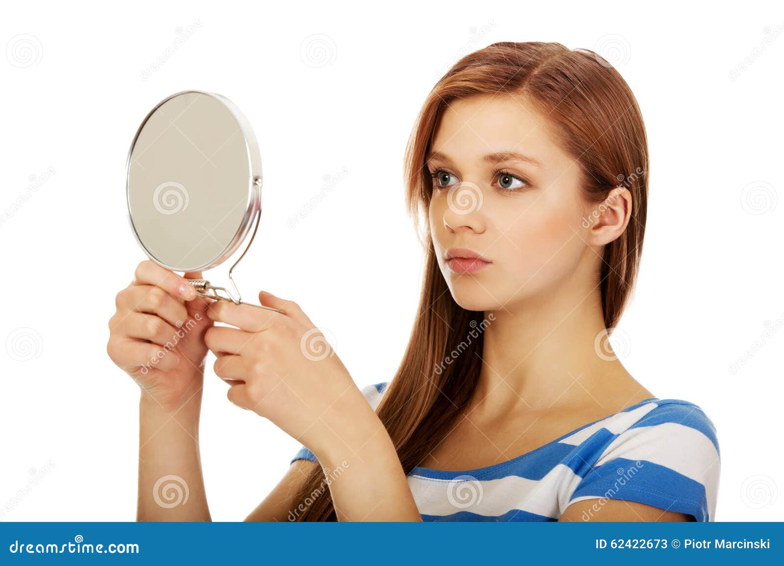 Young Beautiful Woman Looking in a Mirror Stock Image - Image of ...