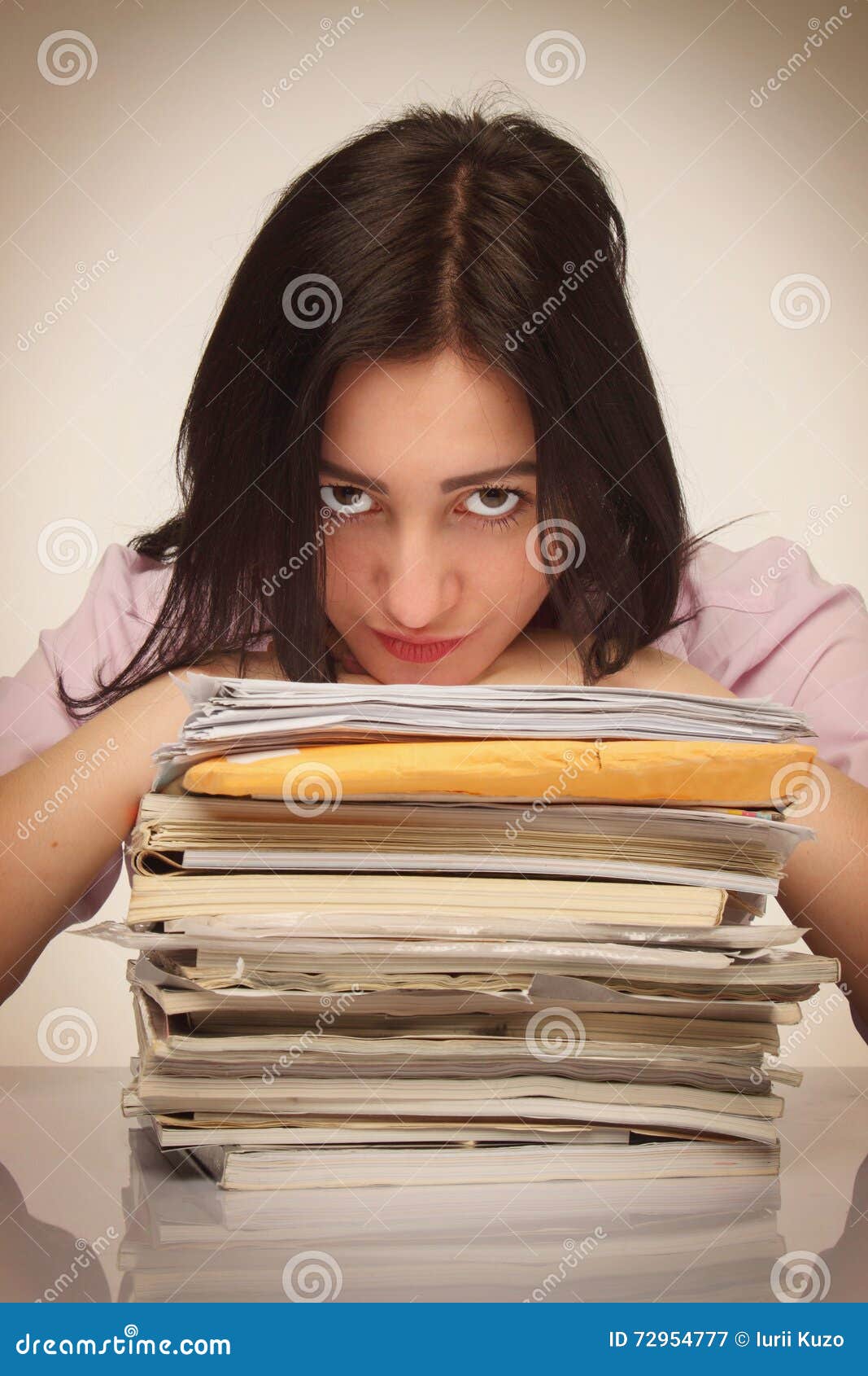 Young Beautiful Woman is Looking Over Work Files Stock Image - Image of ...