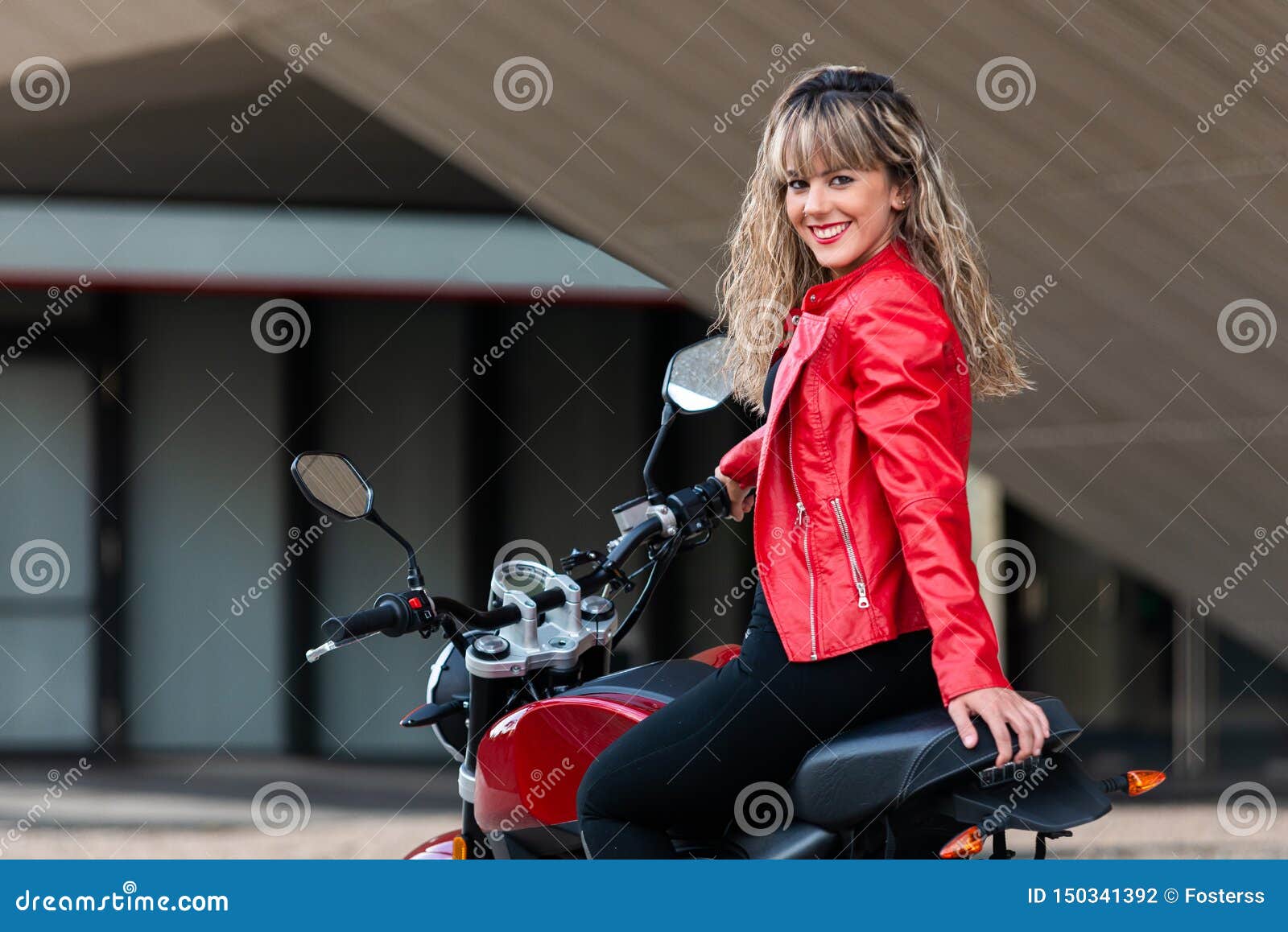 Young Beautiful Woman on Motorcycle Looking Back Stock Photo - Image of ...
