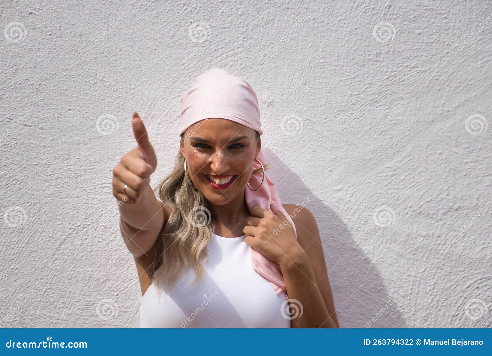 Young And Beautiful Woman With A Pink Scarf Of The Fight Against