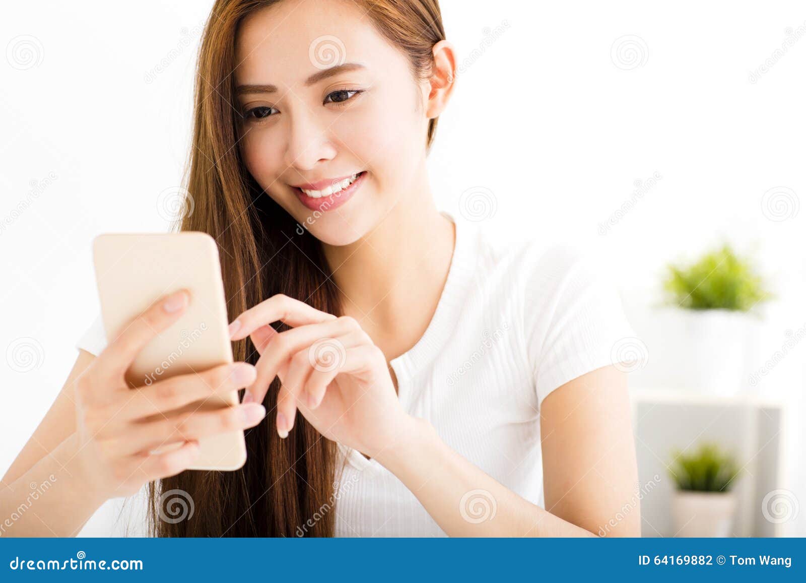 Young Beautiful Woman Reading Message with Smart Phone Stock Photo ...