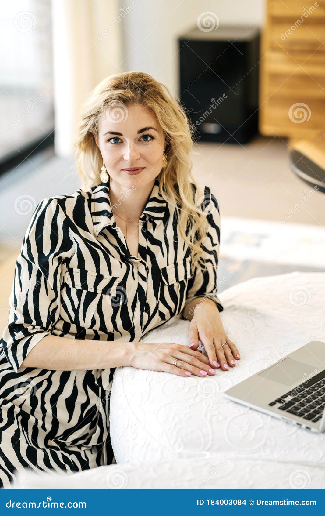 Young Beautiful Woman Sitting On The Floor Working On Laptop Stock