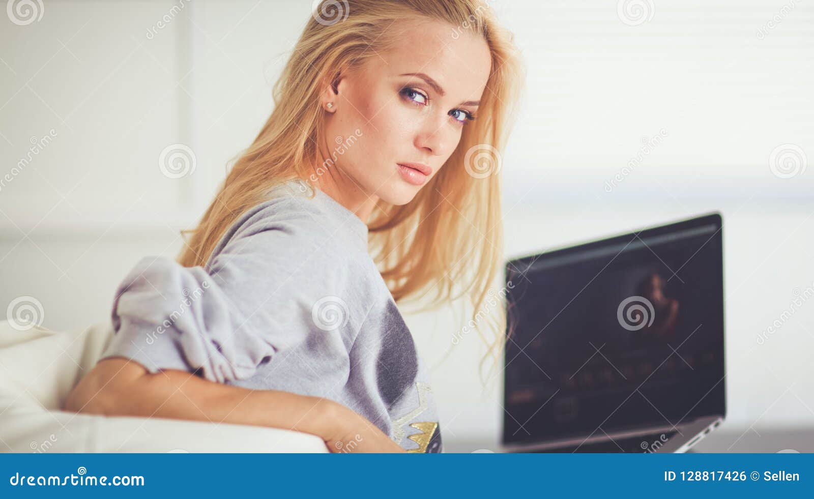Young Beautiful Woman Using a Laptop Computer at Home Stock Photo ...