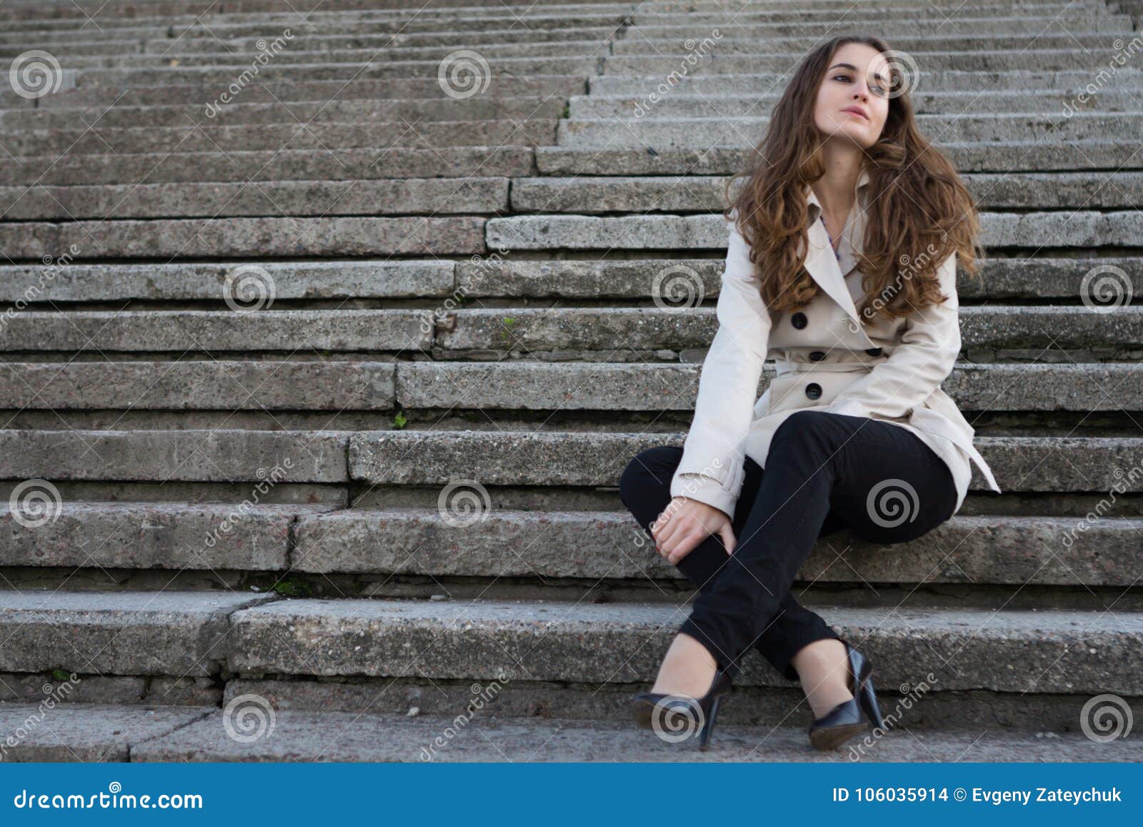 Young Beautiful Woman Wearing Beige Jacket Sitting On Concrete S Stock
