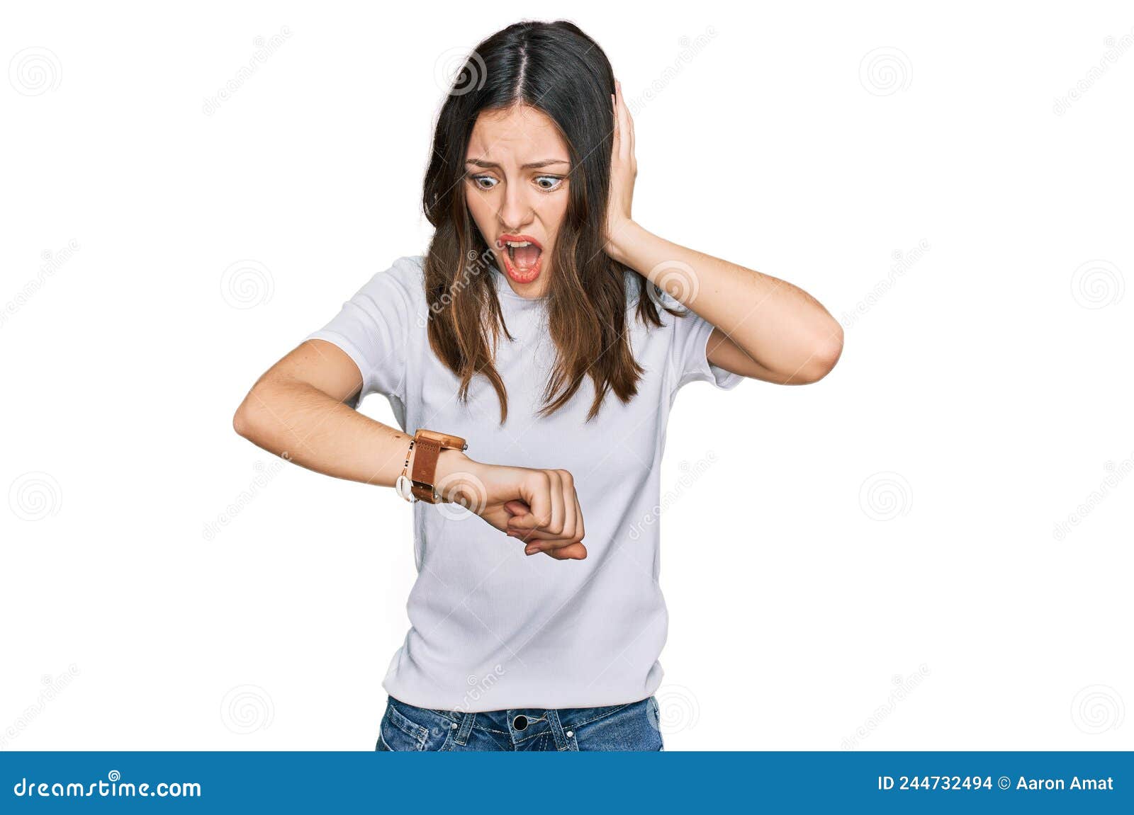 Young Beautiful Woman Wearing Casual White T Shirt Looking At The Watch