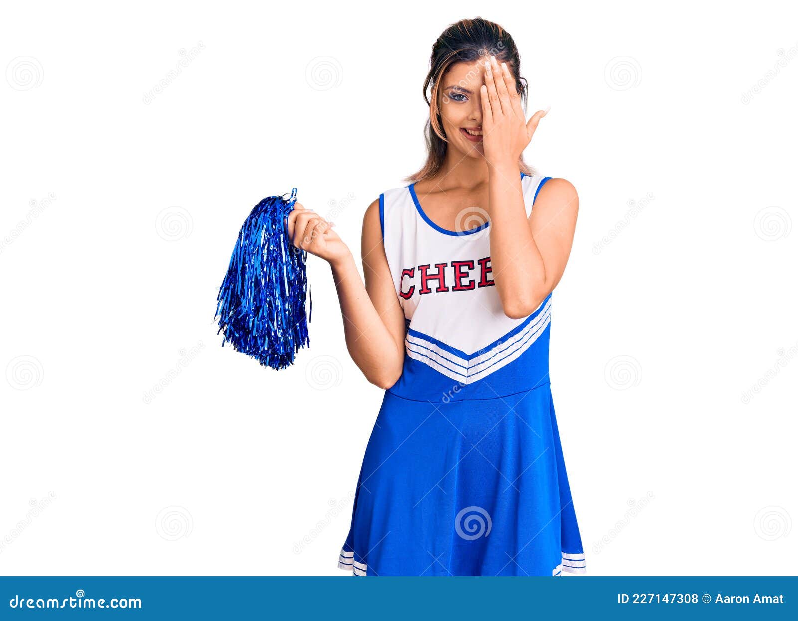 Young Beautiful Woman Wearing Cheerleader Uniform Covering One Eye With
