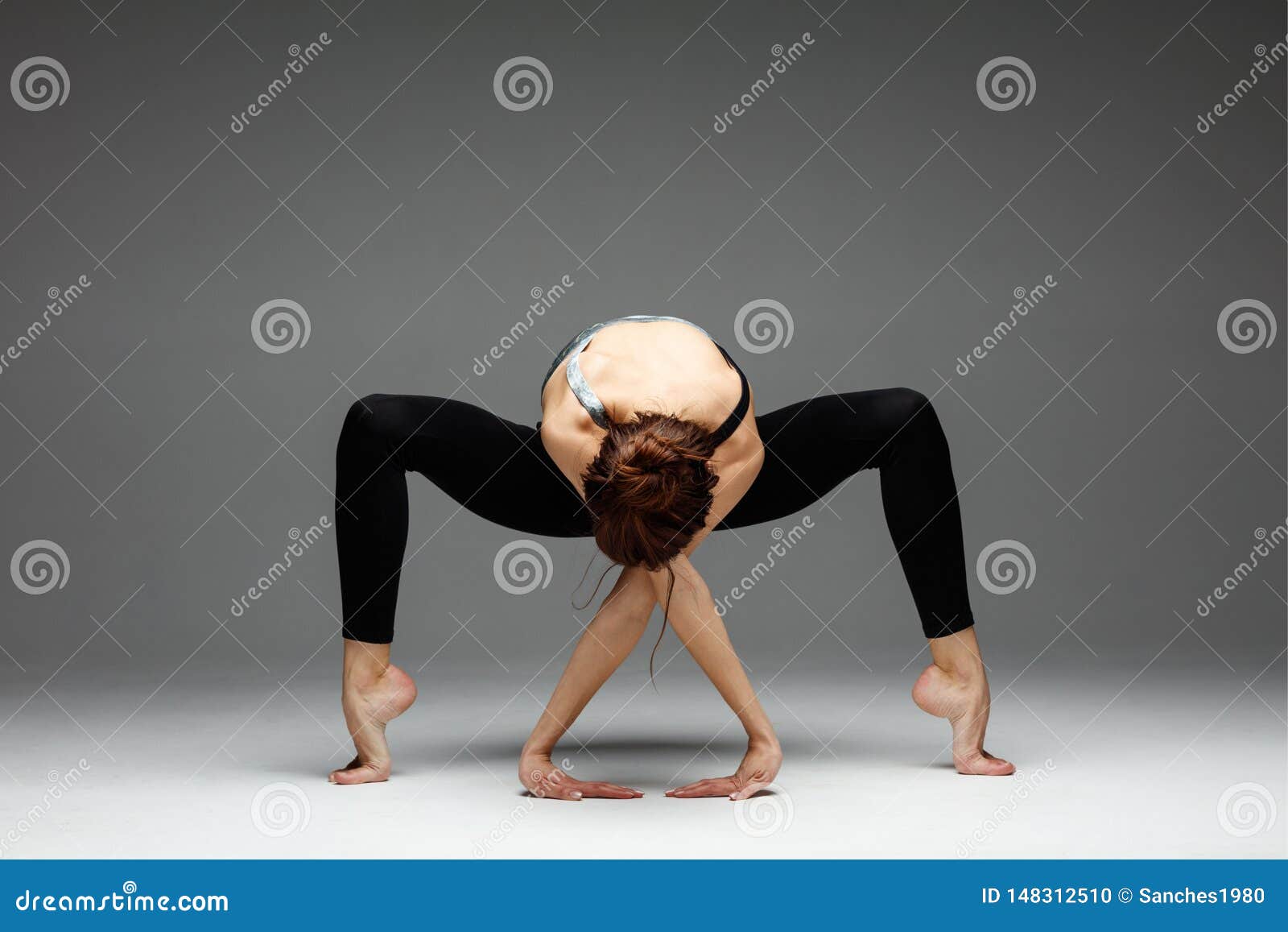 Young Beautiful Yoga Instructor is Posing in Studio. Stock Photo ...