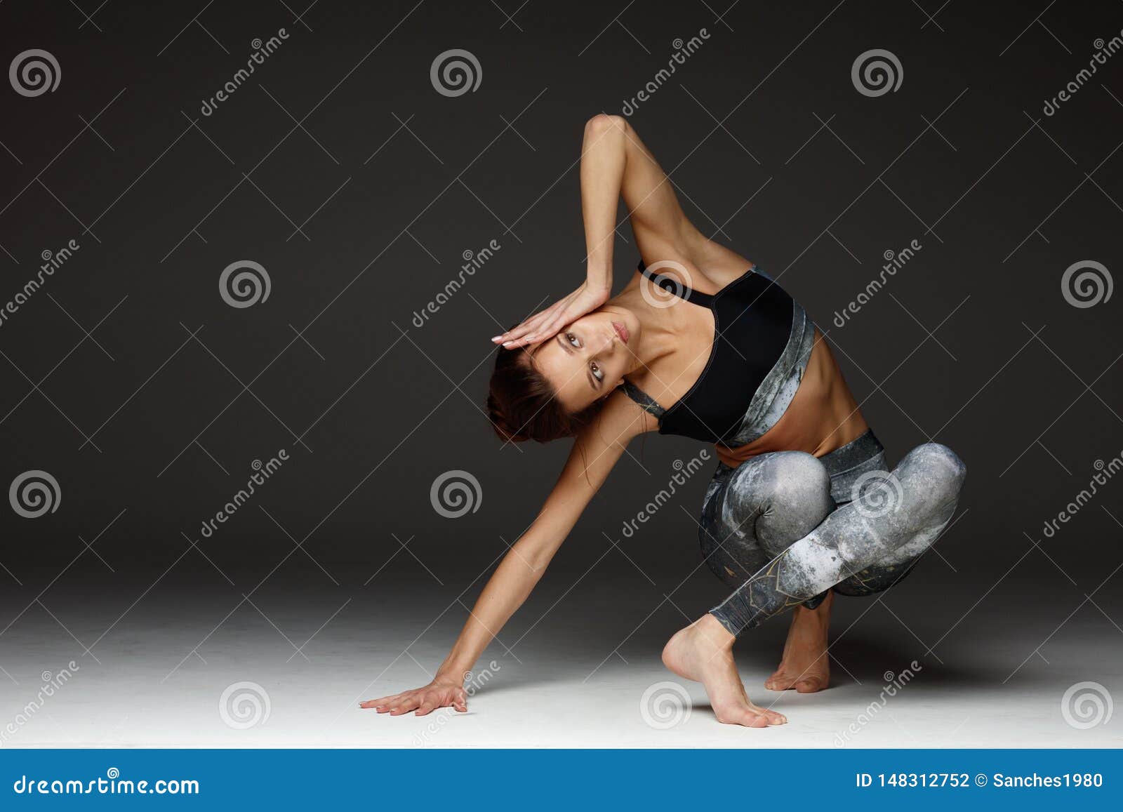 Young Beautiful Yoga Instructor is Posing in Studio. Stock Photo ...