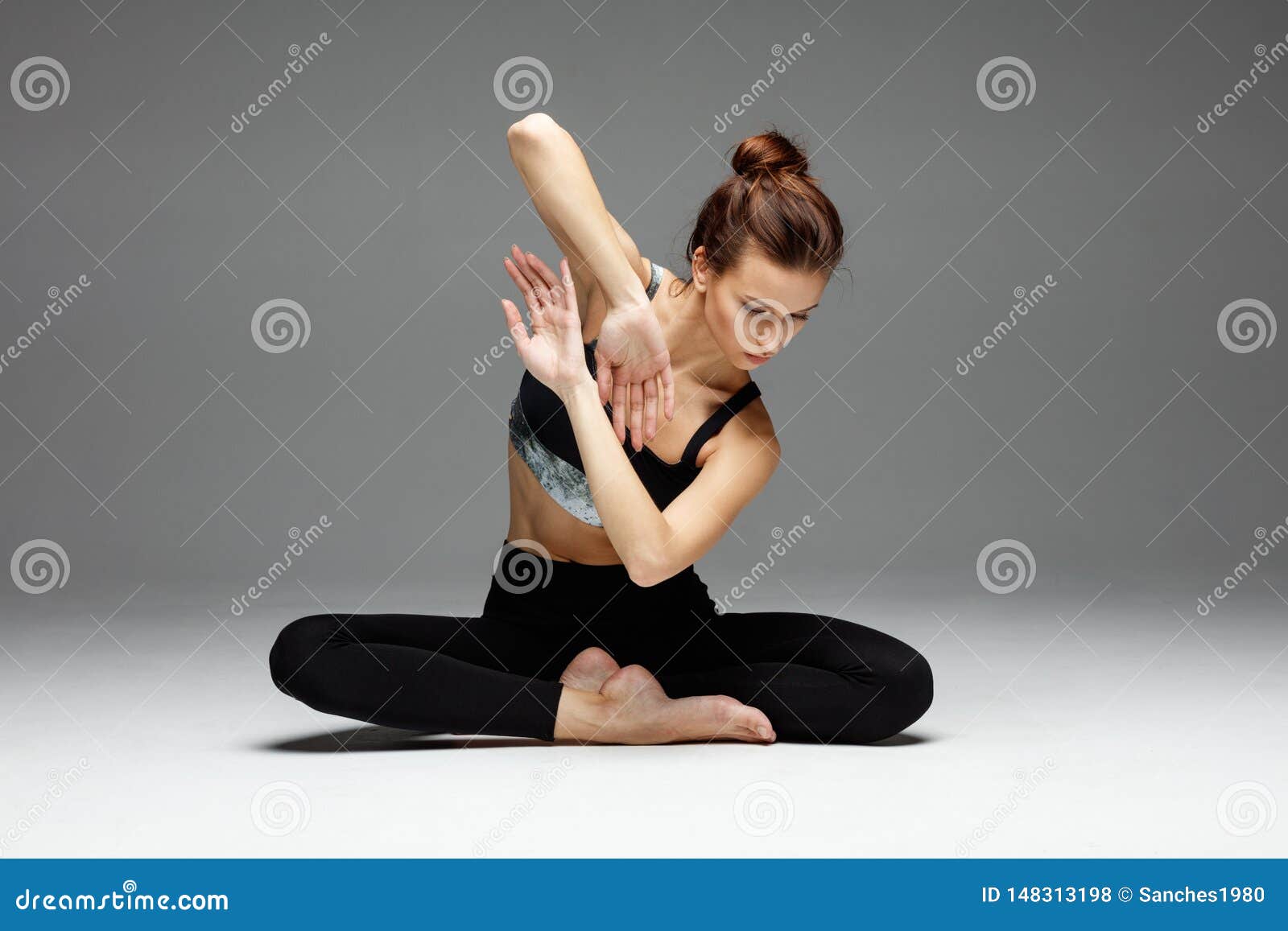 Young Beautiful Yoga Instructor is Posing in Studio. Stock Photo ...