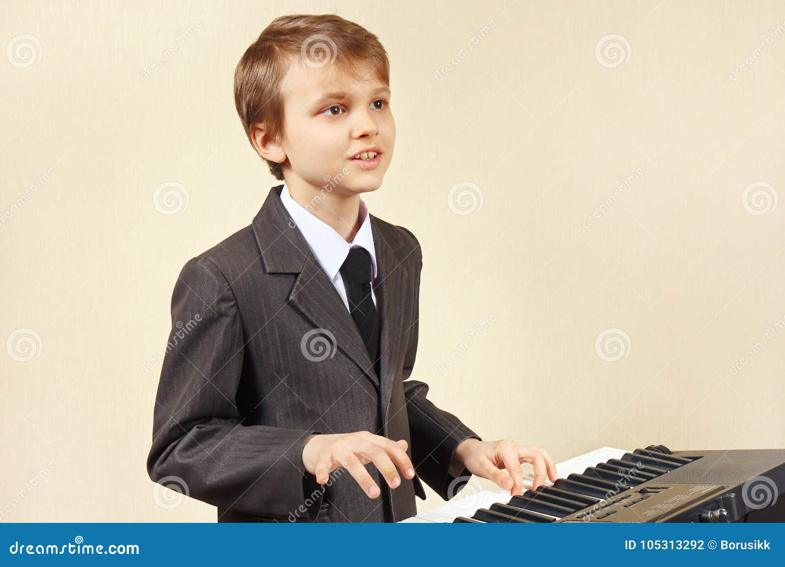 Young Beginner Musician in a Suit Playing Electronic Piano Stock Photo ...
