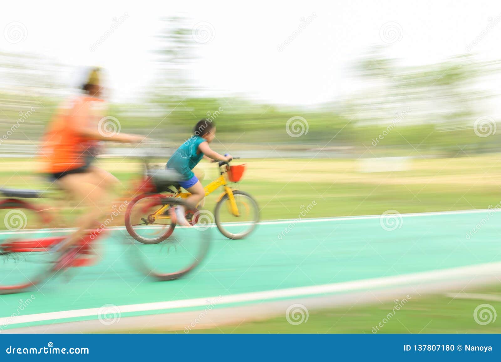 Young Bicycle Rider on a Bicycle Path in Park Stock Photo - Image of ...