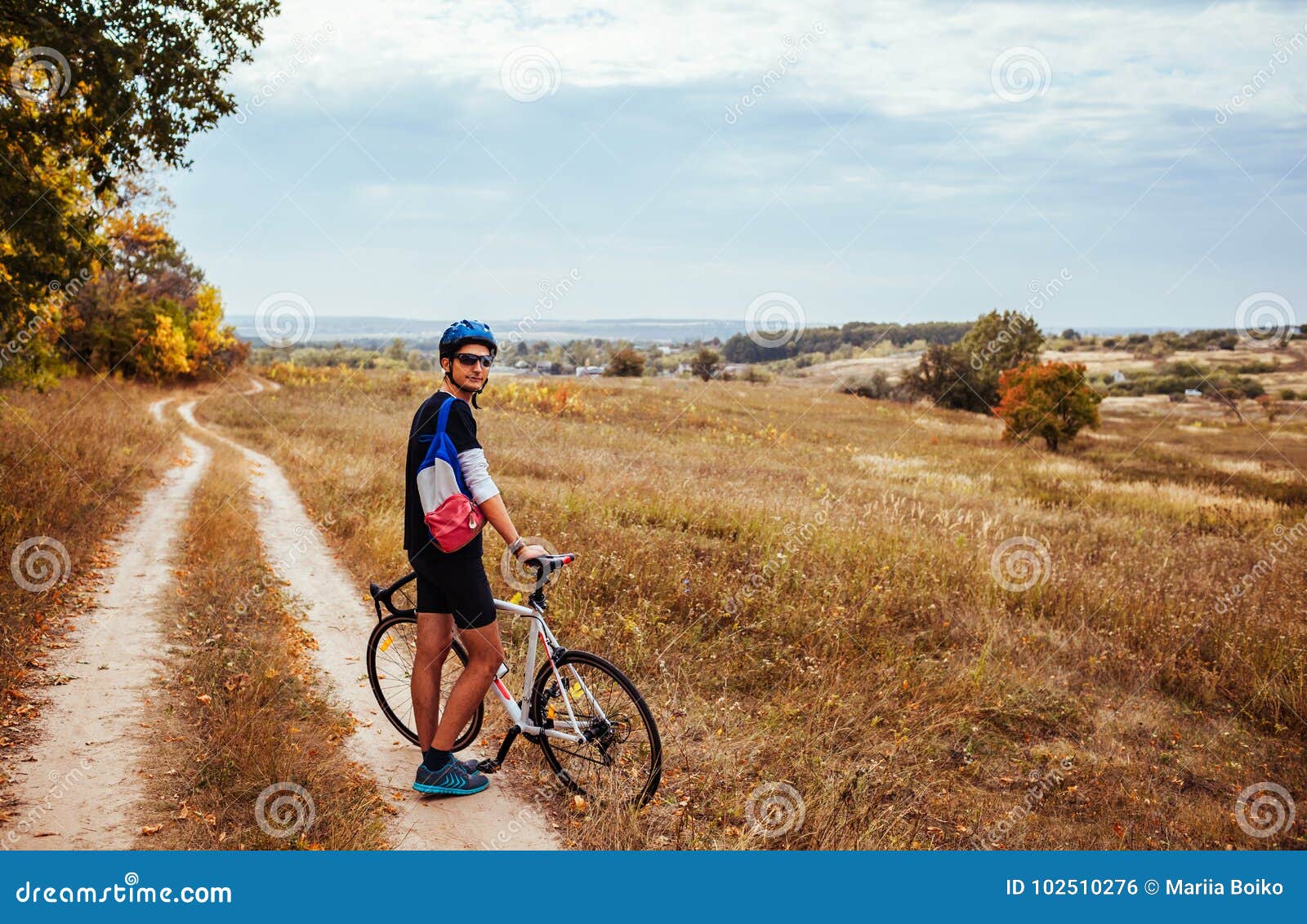 Young Bicyclist Riding in the Field Stock Photo - Image of leaves ...