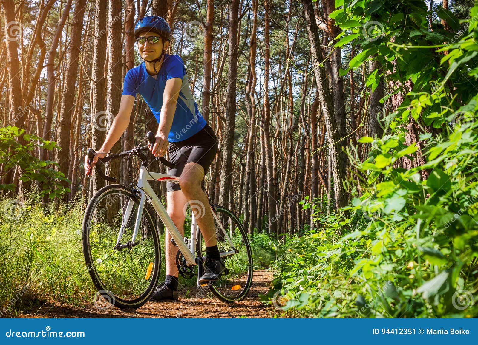 Young Bicyclist Riding in the Forest Stock Image - Image of forest ...