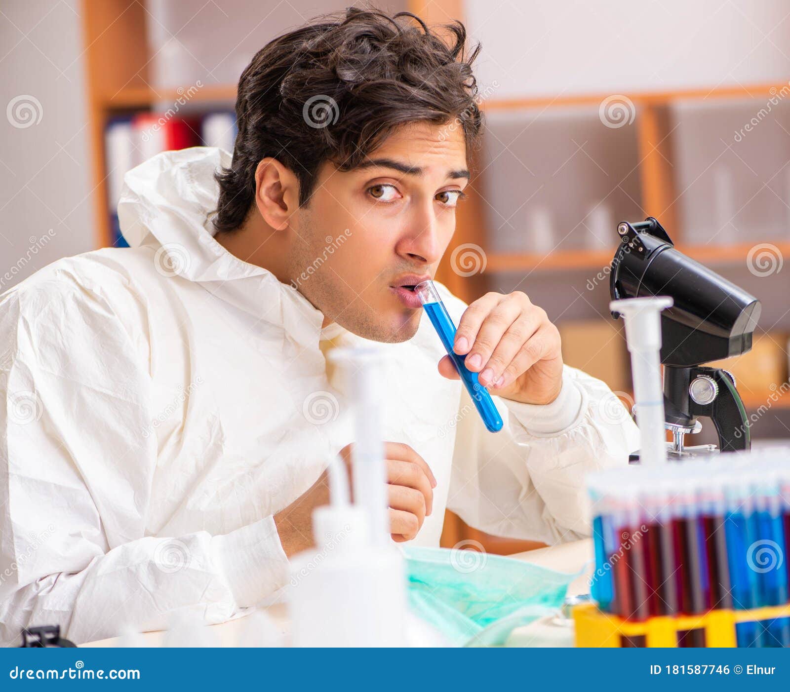 Young Biochemist Wearing Protective Suit Working in the Lab Stock Photo ...