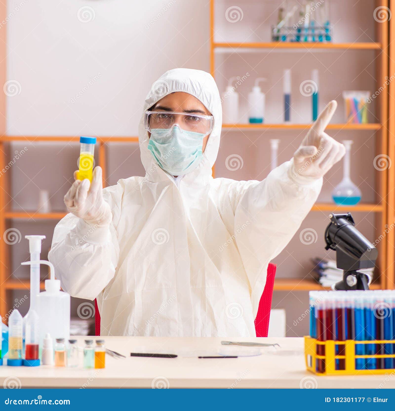 Young Biochemist Wearing Protective Suit Working in the Lab Stock Image ...