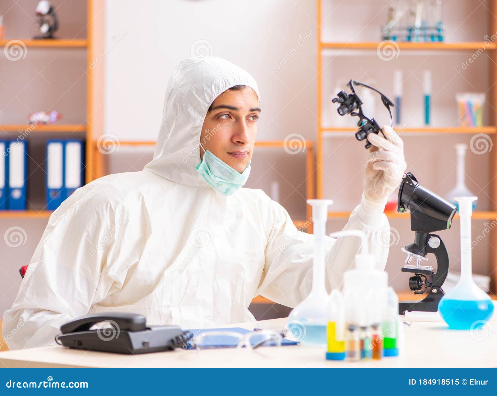 Young Biochemist Wearing Protective Suit Working in the Lab Stock Image ...