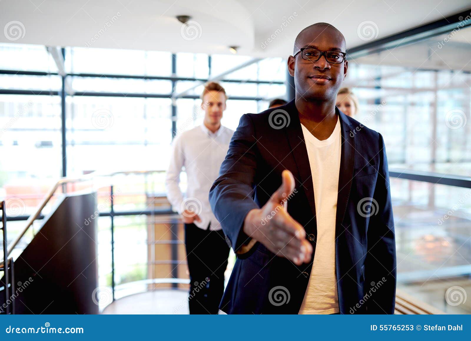 Young Black Executive Facing Camera with Hand Out. Stock Image - Image ...