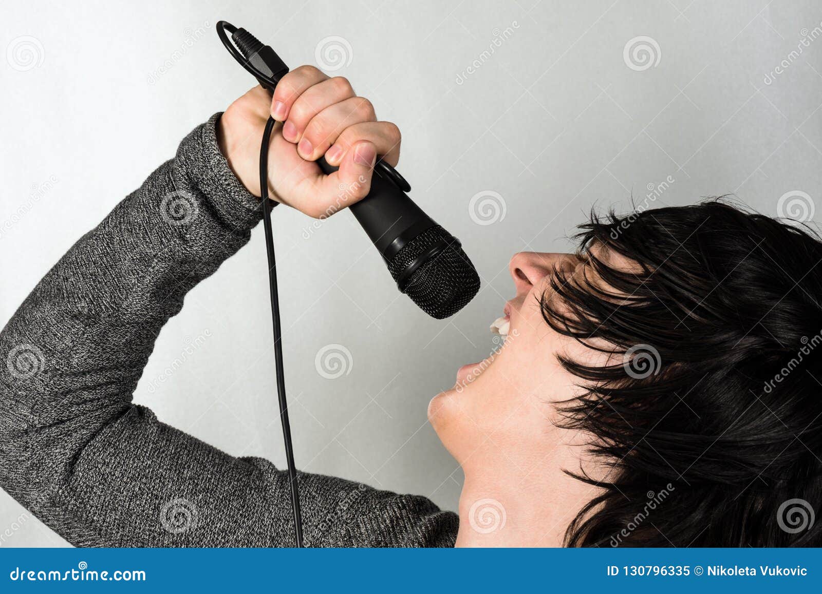 Screaming in microphone stock image. Image of gray, expression - 130796335