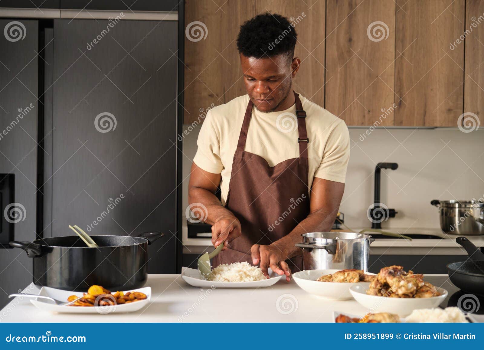 Young Black Man Serving Rice on a Plate. Stock Image - Image of home ...
