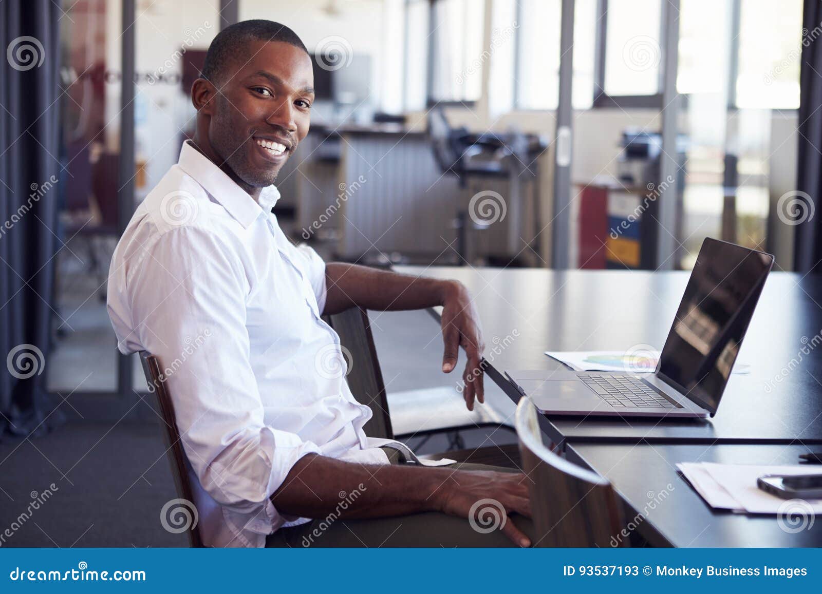 Dark Man Sitting In Office