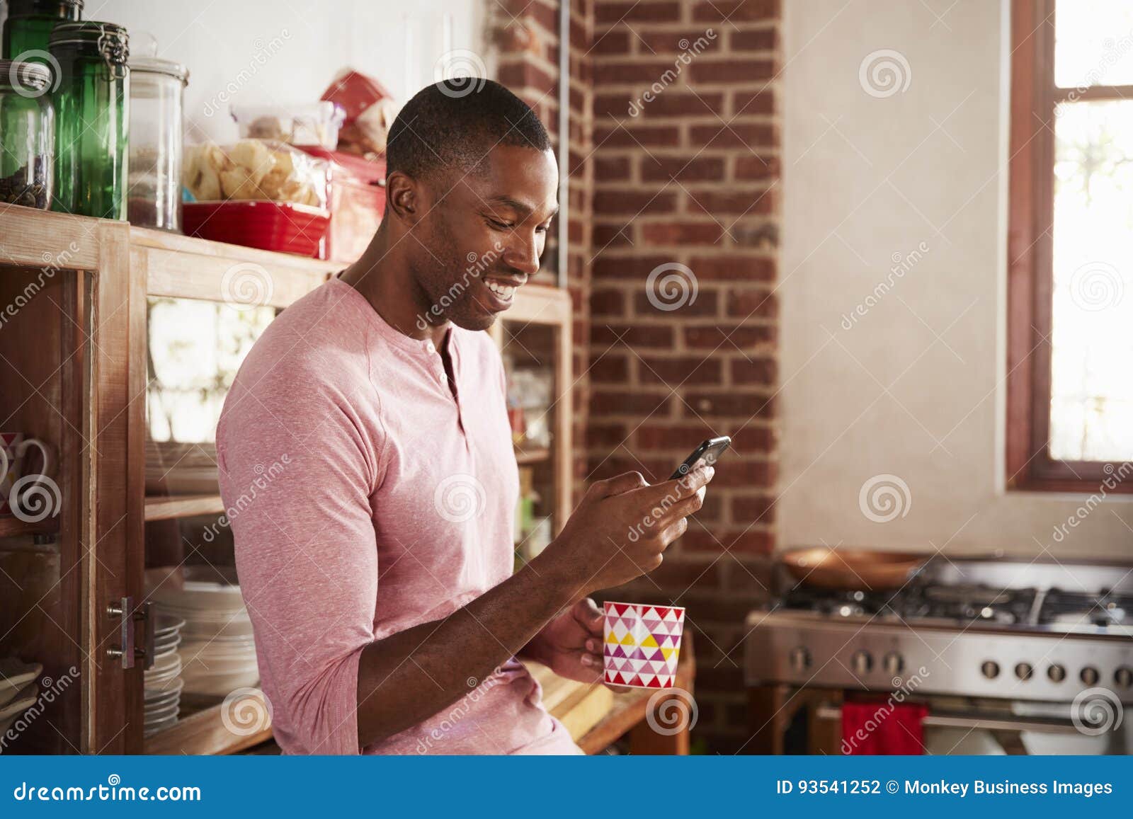 Young Black Man Using Smartphone in Kitchen, Close Up Stock Photo ...