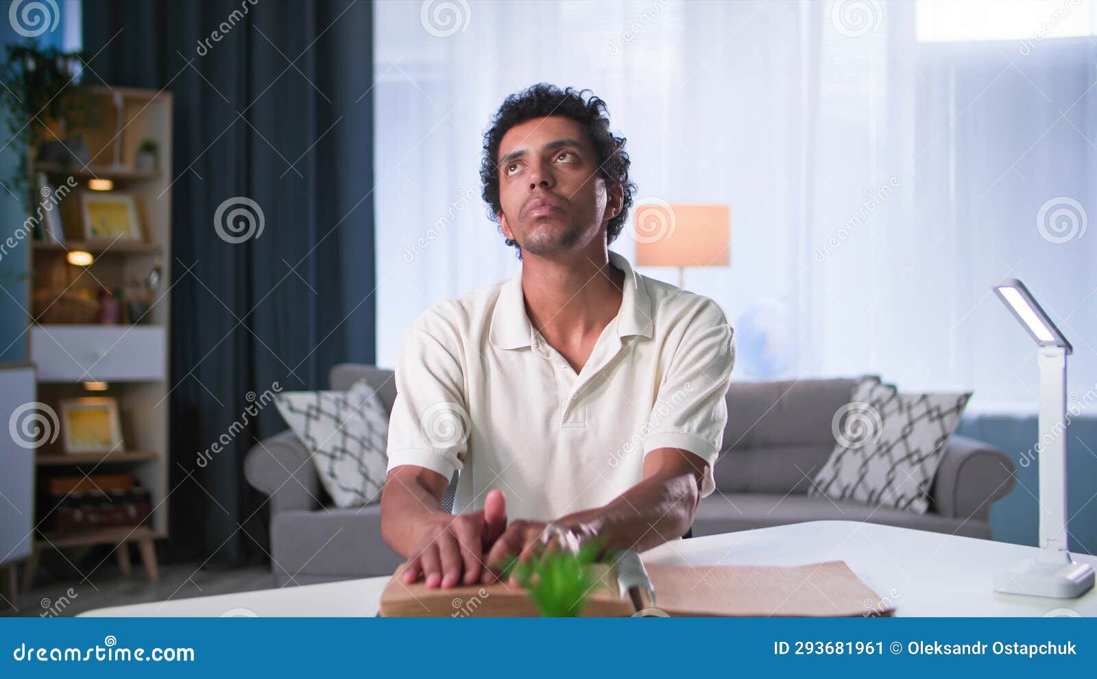 Young Black Man with Vision Problems Studying a Book for the Blind ...