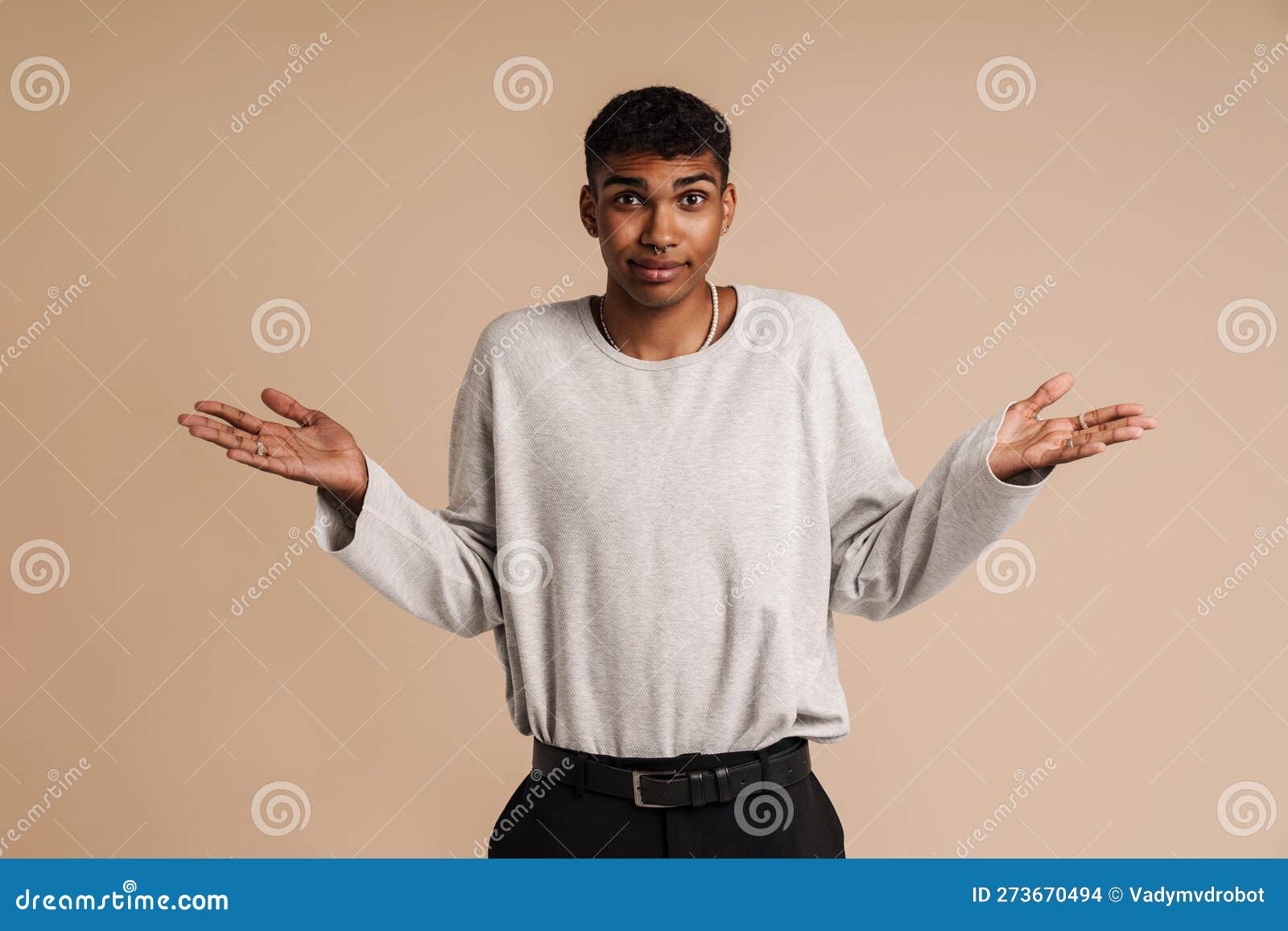 Young Black Man Wearing Rings Looking and Gesturing at Camera Stock ...