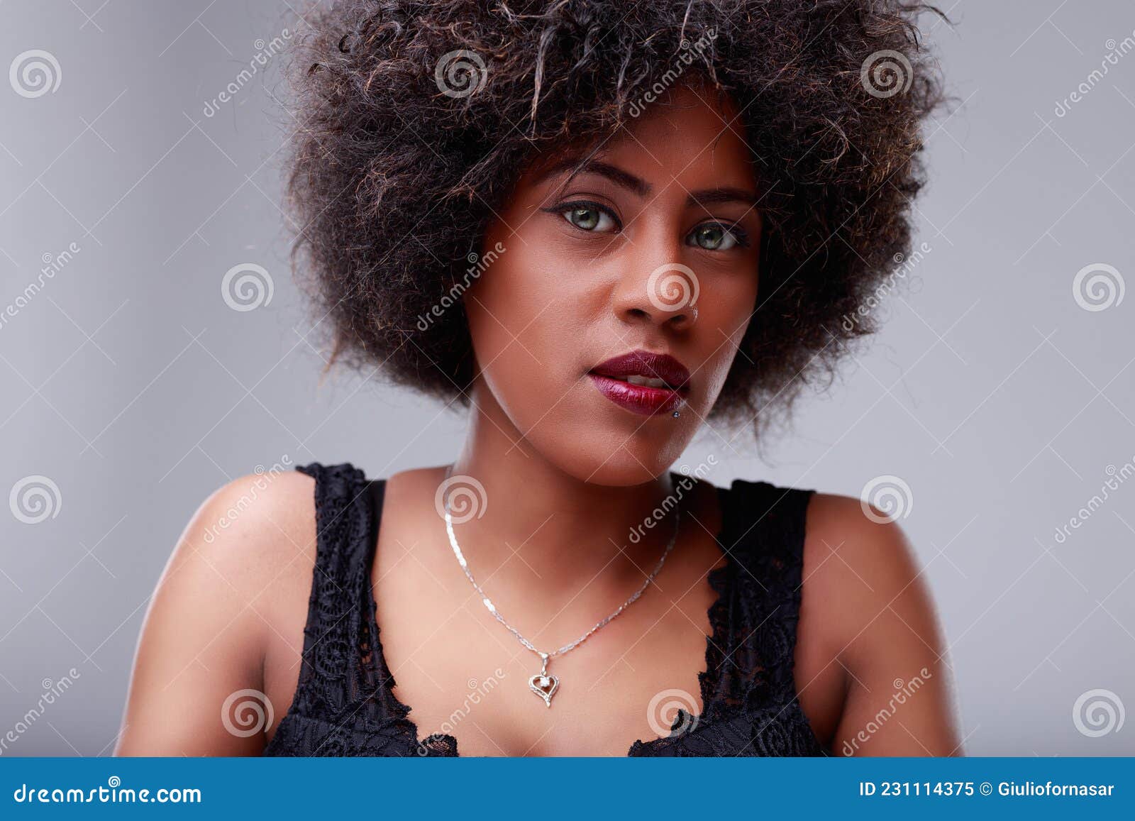 Young Black Woman With Beautiful Grey Eyes Looking At Camera Stock