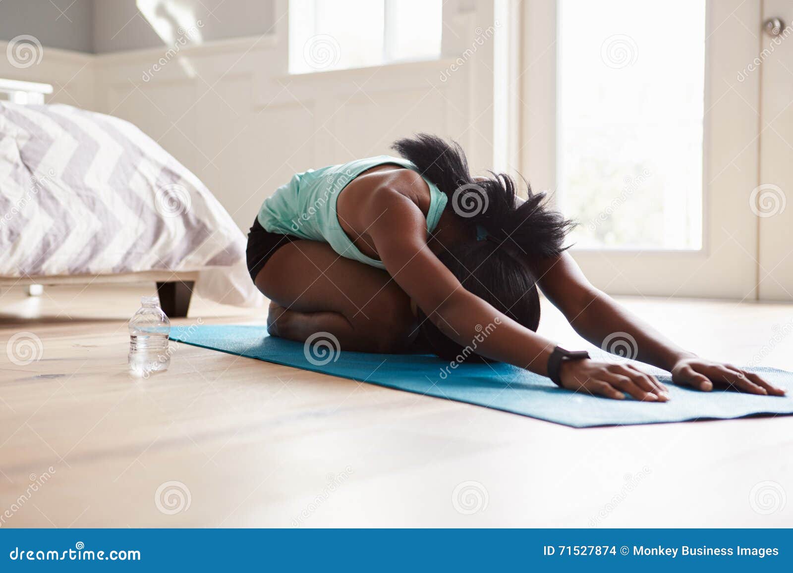 Young Black Woman Practicing Yoga In The Cat Stretch Pose Stock ...