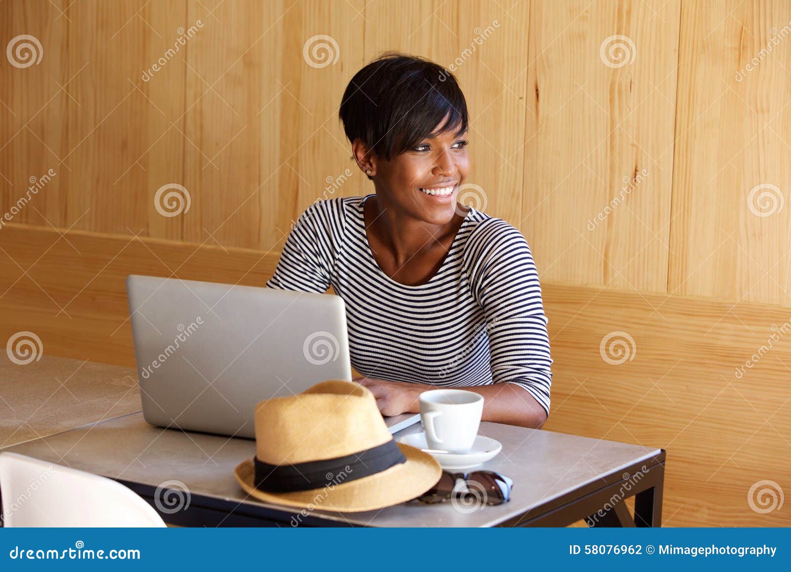 Young Black Woman Smiling and Using Laptop Stock Photo - Image of ...