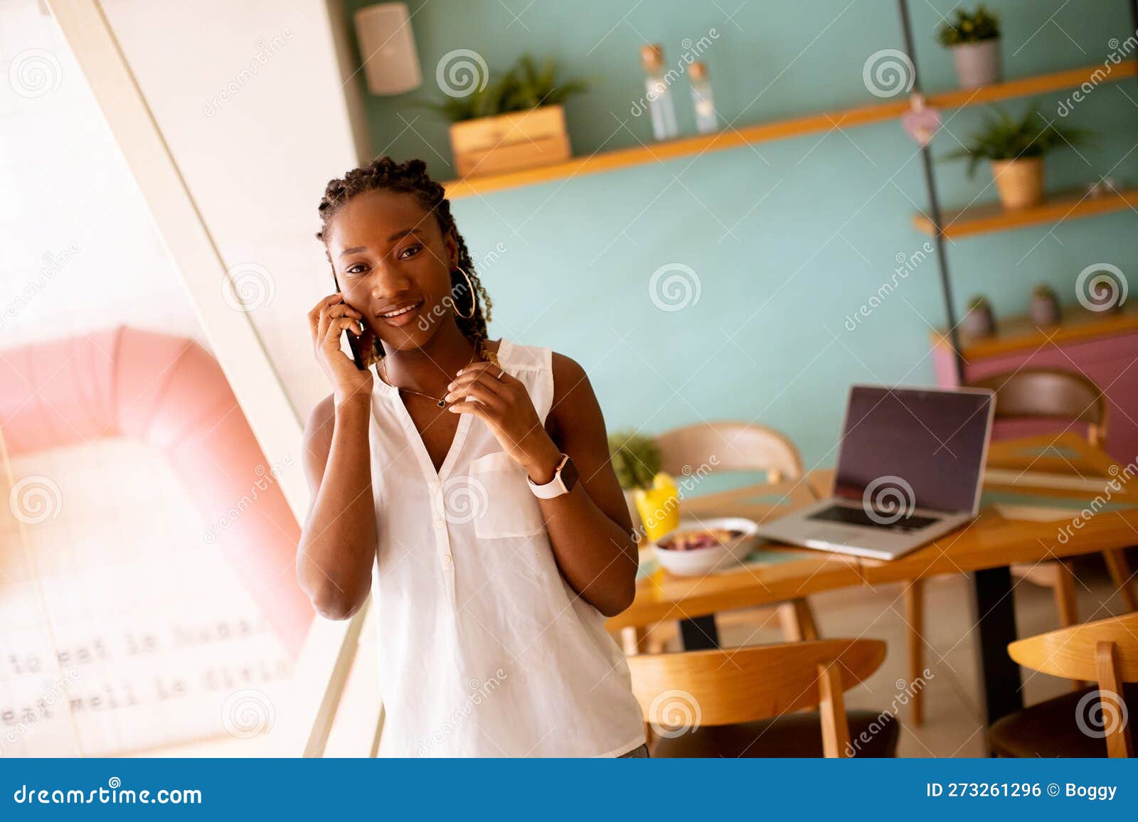 Young Black Woman Using Mobile Phone in the Cafe Stock Photo - Image of ...