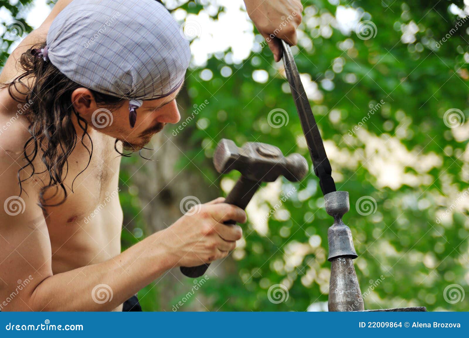 Young Blacksmith Hammering Hot Iron Stock Photo - Image of blacksmith ...