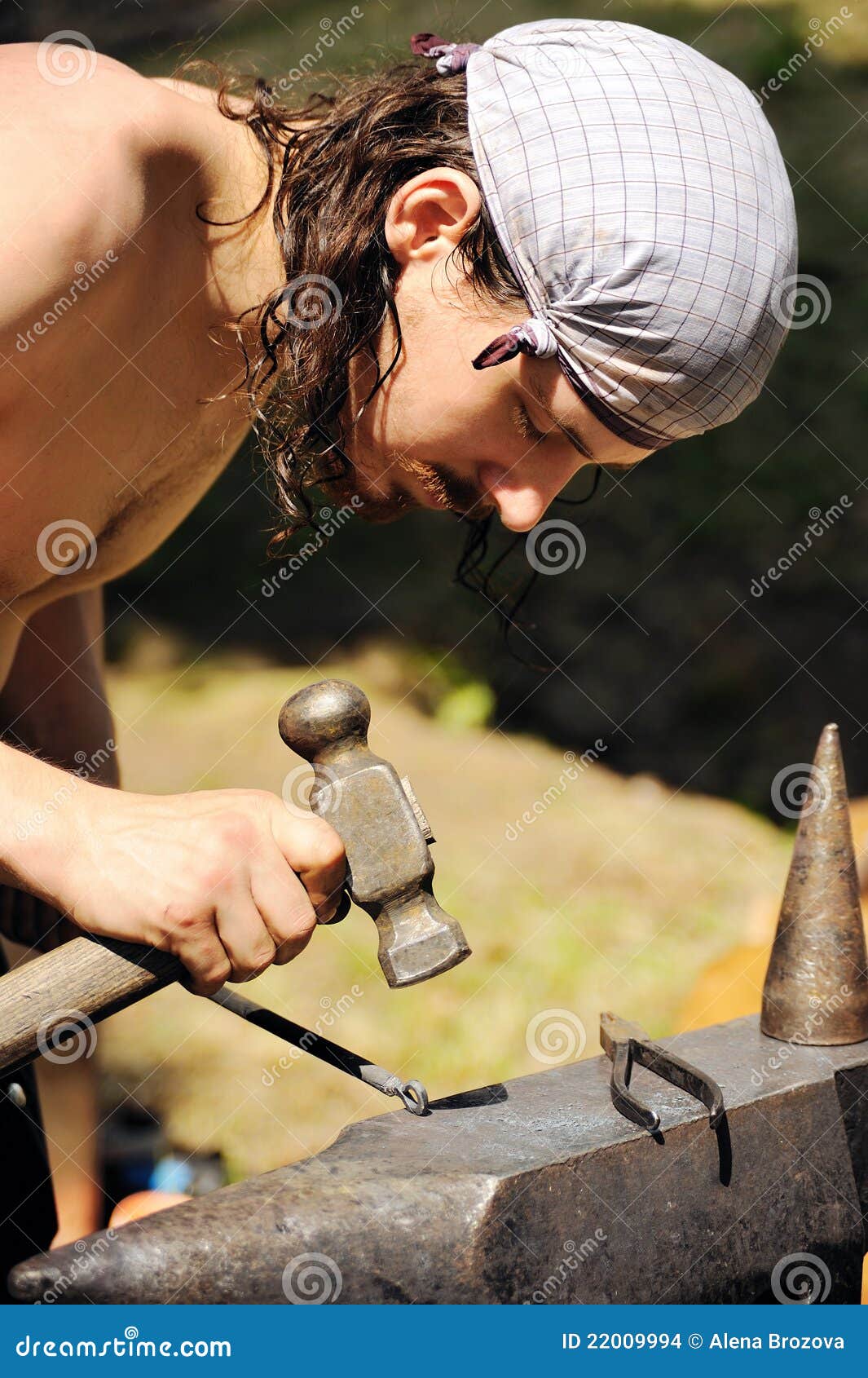 Young Blacksmith Hammering Hot Iron Stock Photo - Image of blacksmith ...