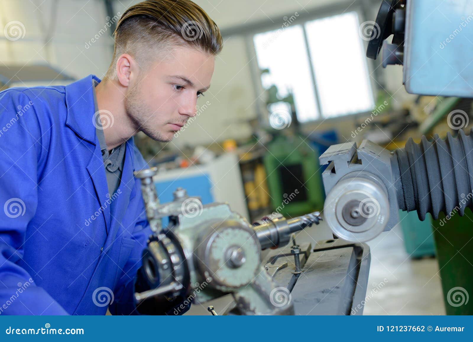Young blacksmith at work stock photo. Image of specification - 121237662