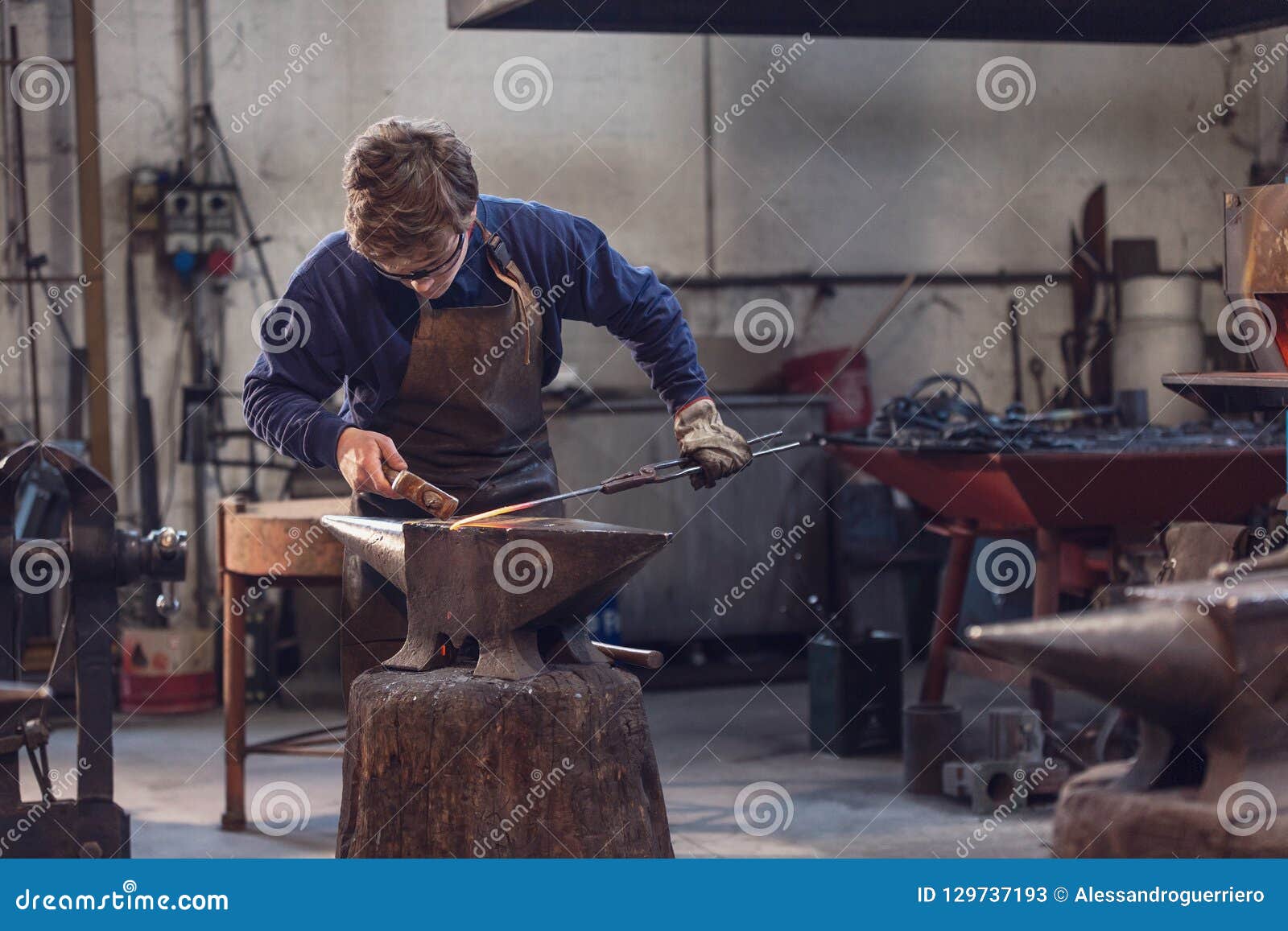 Young Blacksmith Working with Red Hot Metal Stock Image - Image of ...