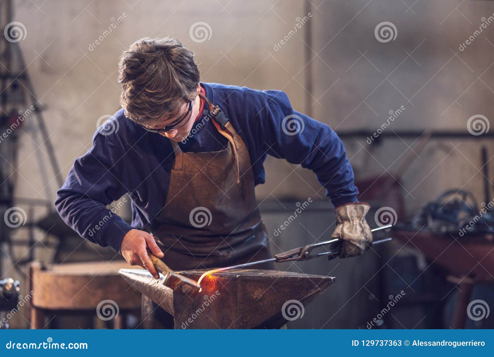 Young Blacksmith Working with Red Hot Metal Stock Image - Image of ...