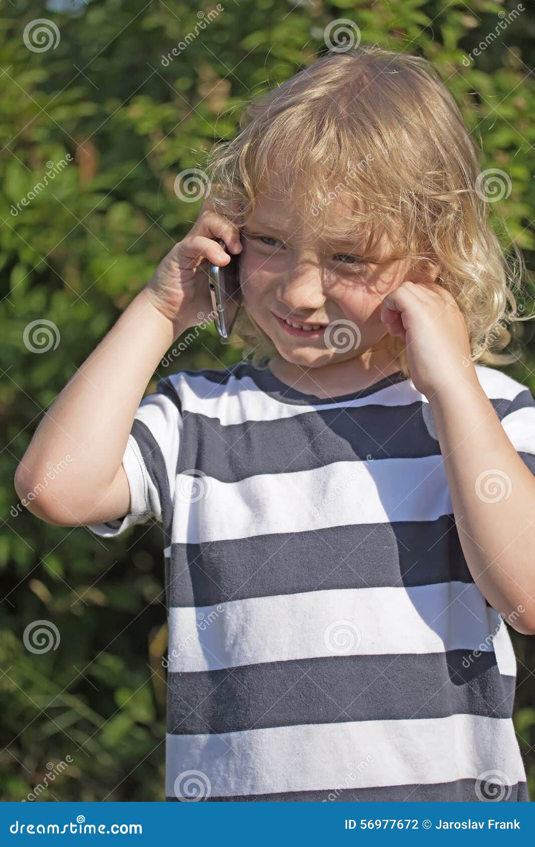 Young blond boy is calling stock photo. Image of outdoors - 56977672